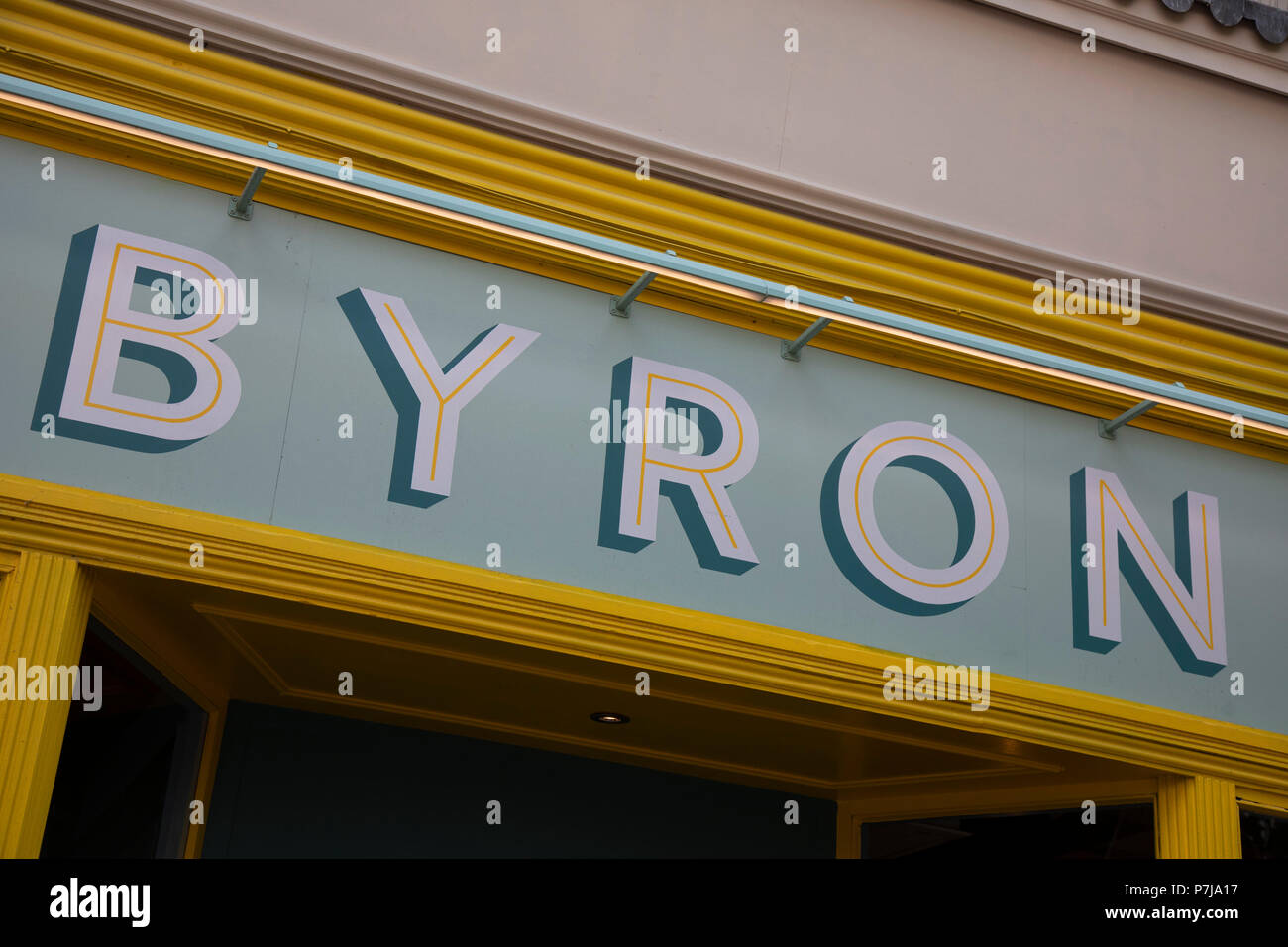 Sign for the food and burger restaurant brand Byron in Birmingham ...