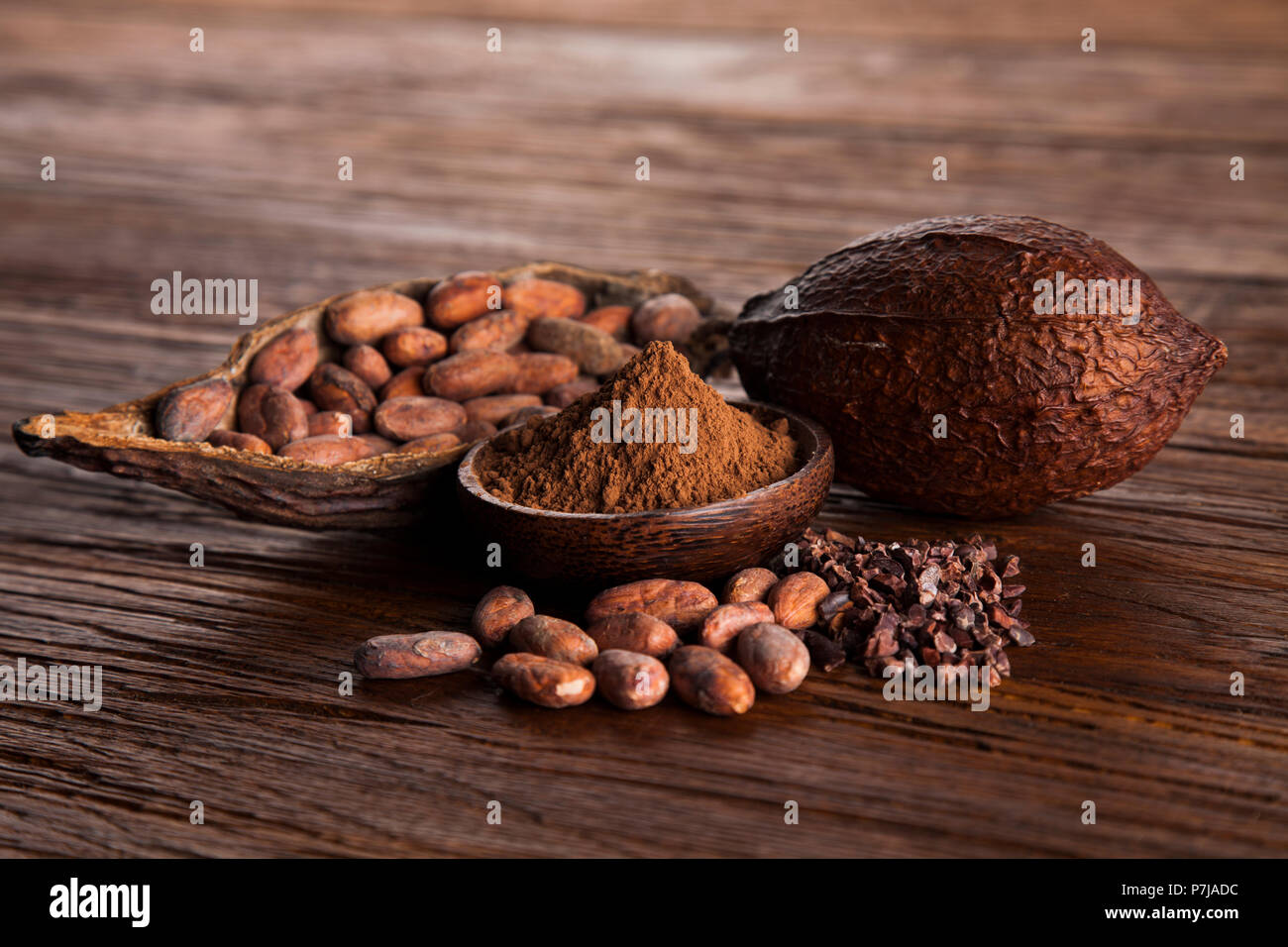 Cacao beans and powder and food dessert background Stock Photo - Alamy
