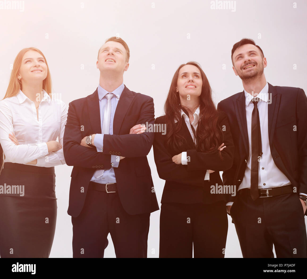 successful business team looking up Stock Photo - Alamy