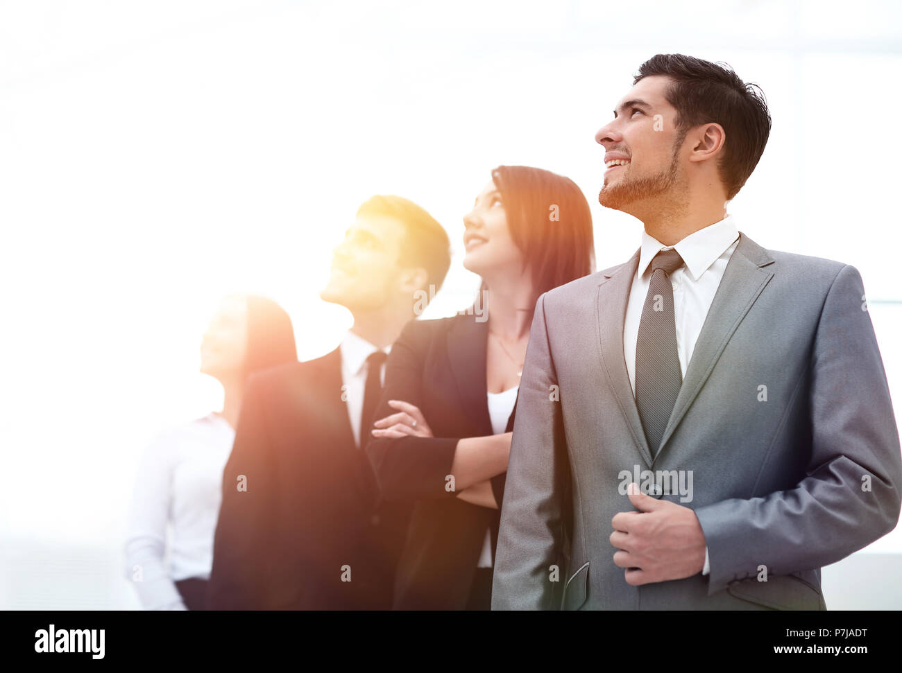 business team standing one behind the other and looking forward Stock ...