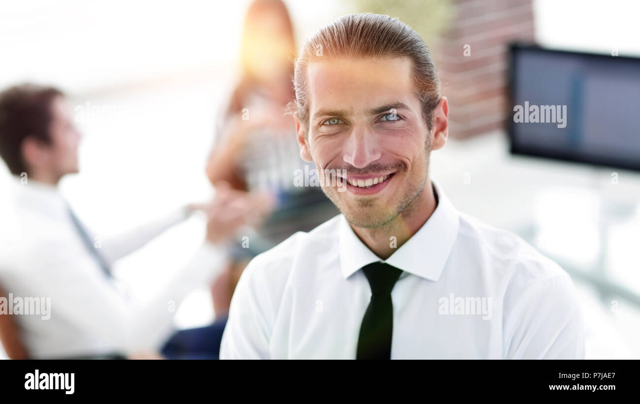 successful young business men on blurred background Stock Photo - Alamy