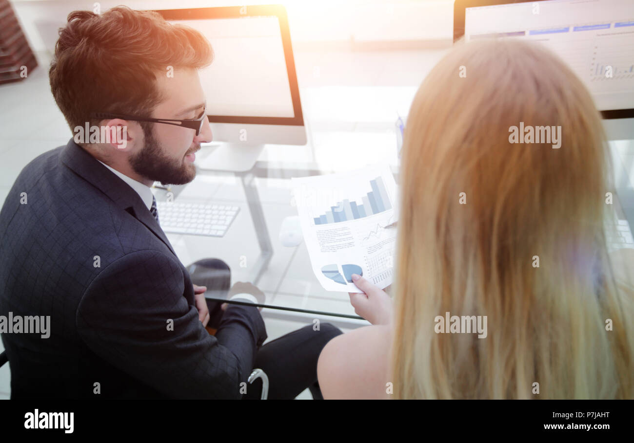 close-up of the company's employees work with financial information ...