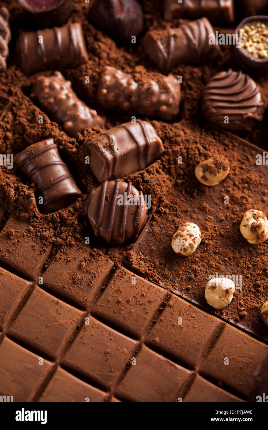 Chocolate bar, candy sweet, cacao beans and powder on wooden background ...