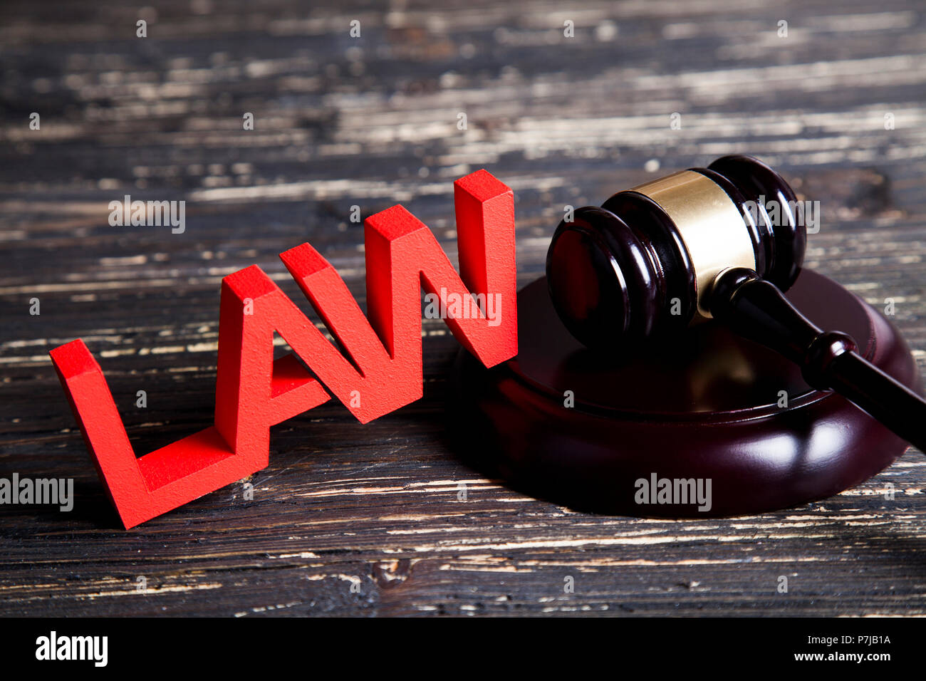 Law theme, mallet of the judge, justice scale, wooden desk background ...