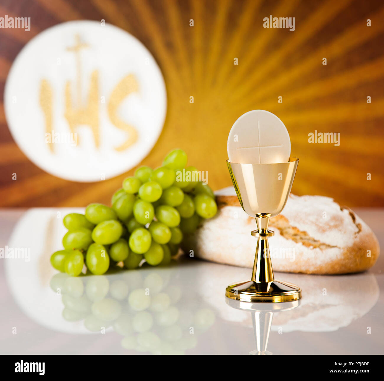 Holy communion a golden chalice with grapes and bread wafers Stock ...
