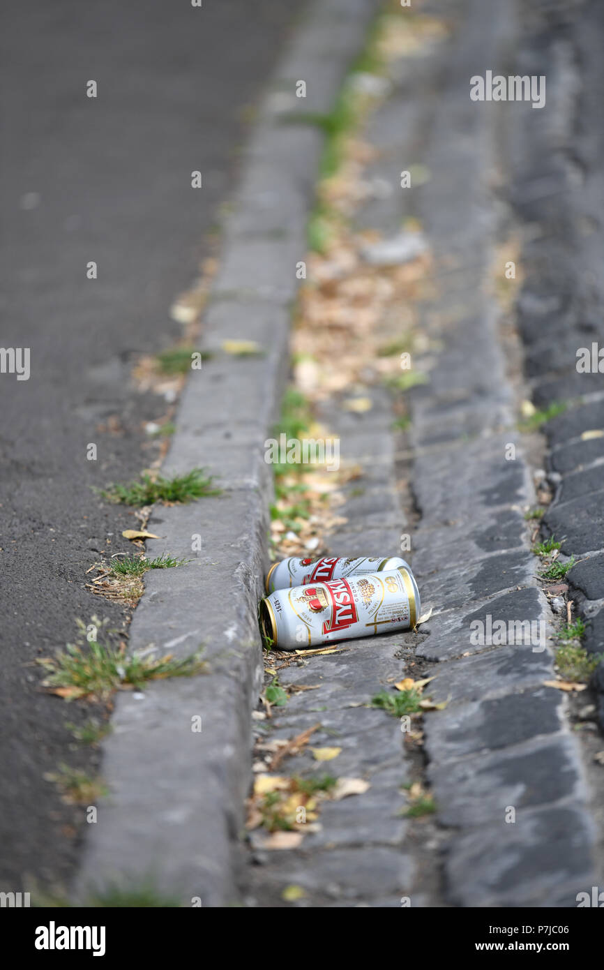 Empty larger cans in road Stock Photo - Alamy