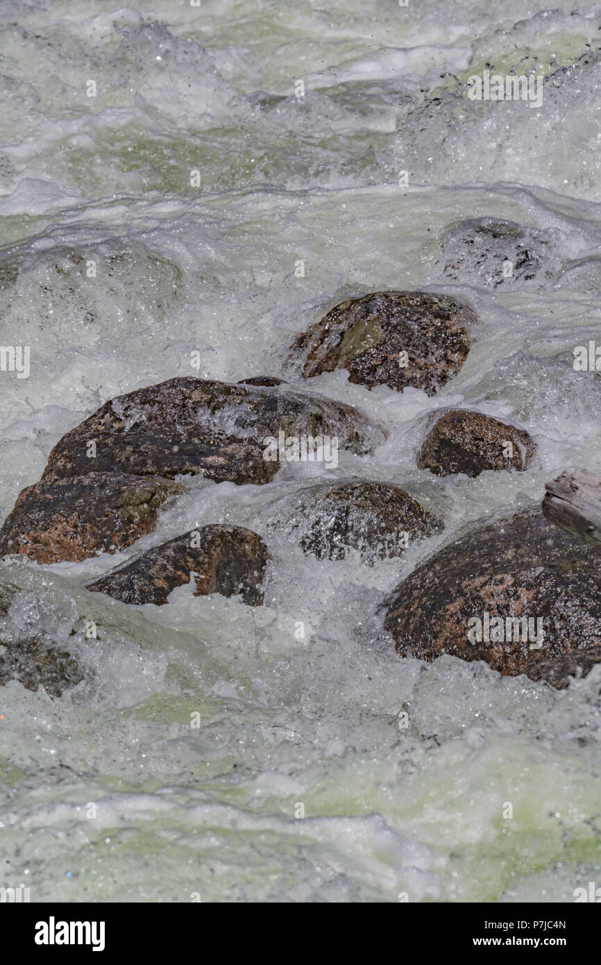 fast flowing water over rocks Stock Photo - Alamy