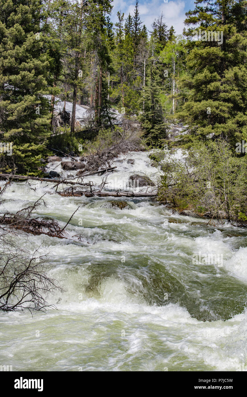 Spring - Melting snow and ice fast flowing down mountain Stock Photo ...