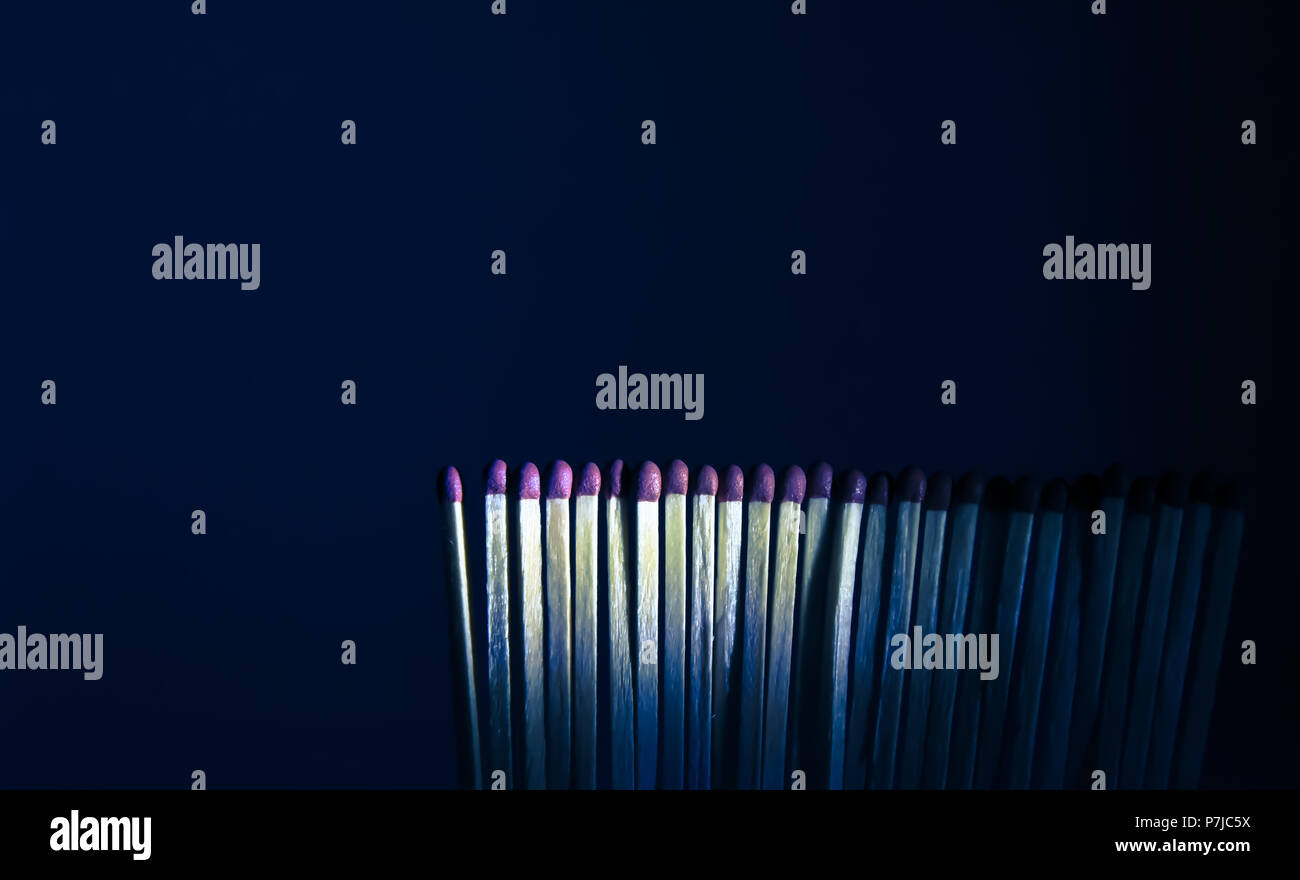 Matchsticks stacked beside each other, aligned matchsticks. unlit ...