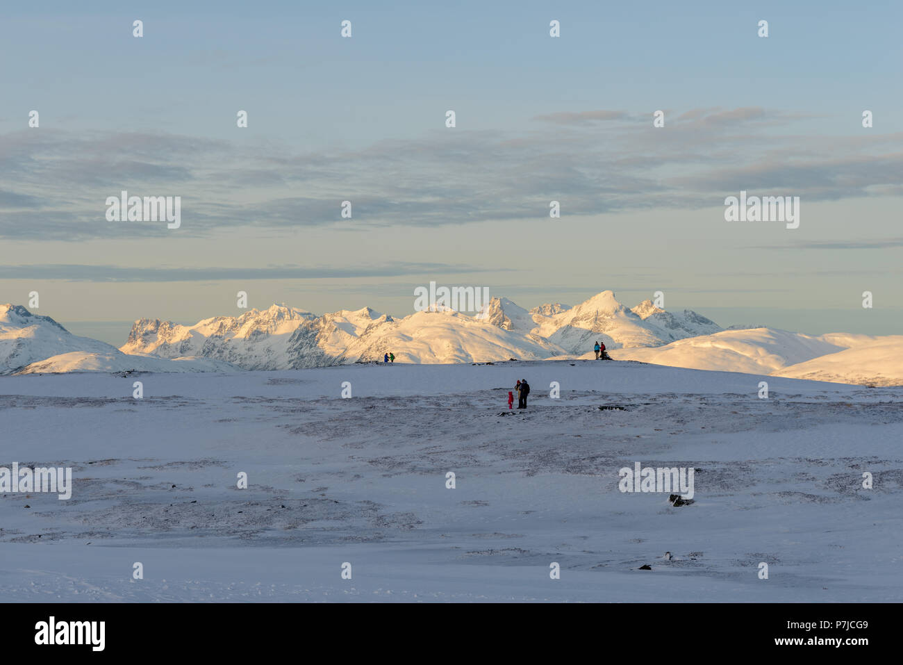 Snow covered landscape with mountains in the background. Fløya, Tromsø ...