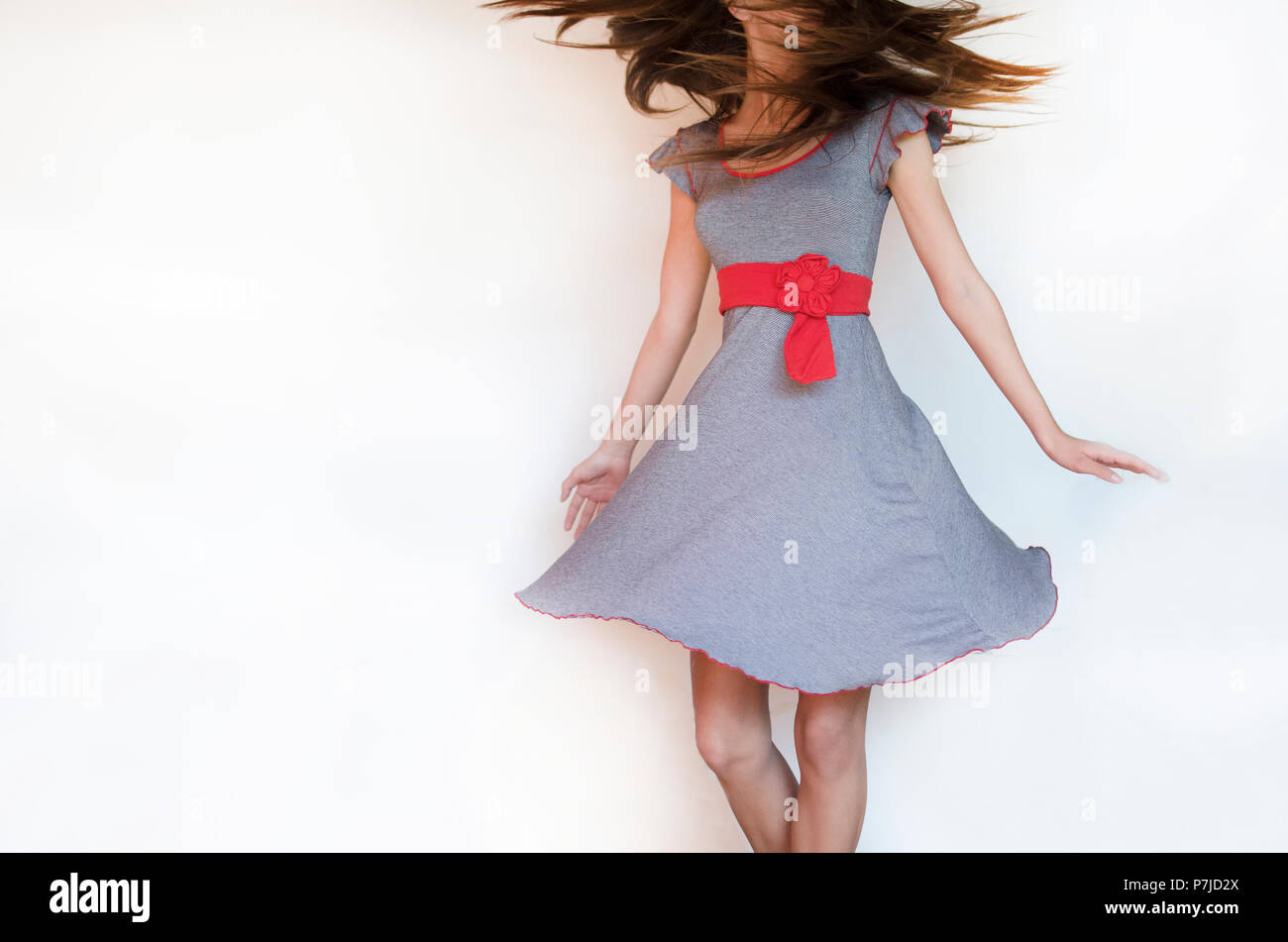 Girl in a dress spinning around Stock Photo - Alamy