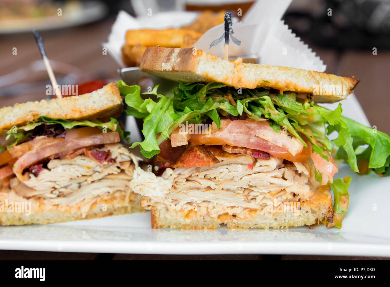 Delicious turkey club sandwich on toast with bacon, lettuce and tomato ...