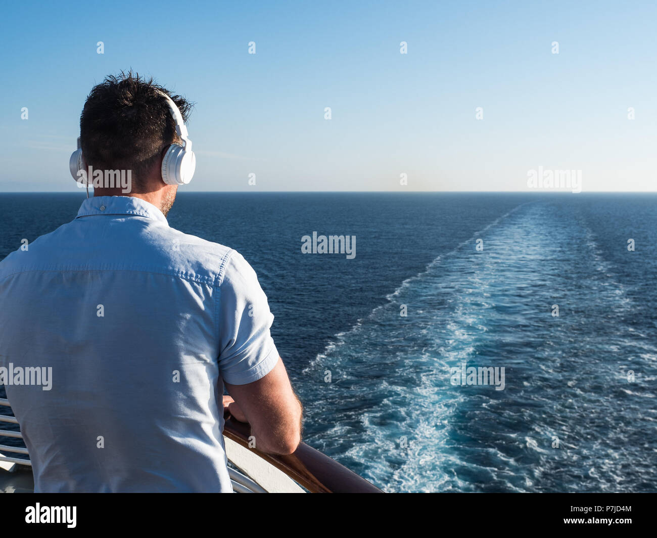 Man on the deck of a cruise ship Stock Photo - Alamy
