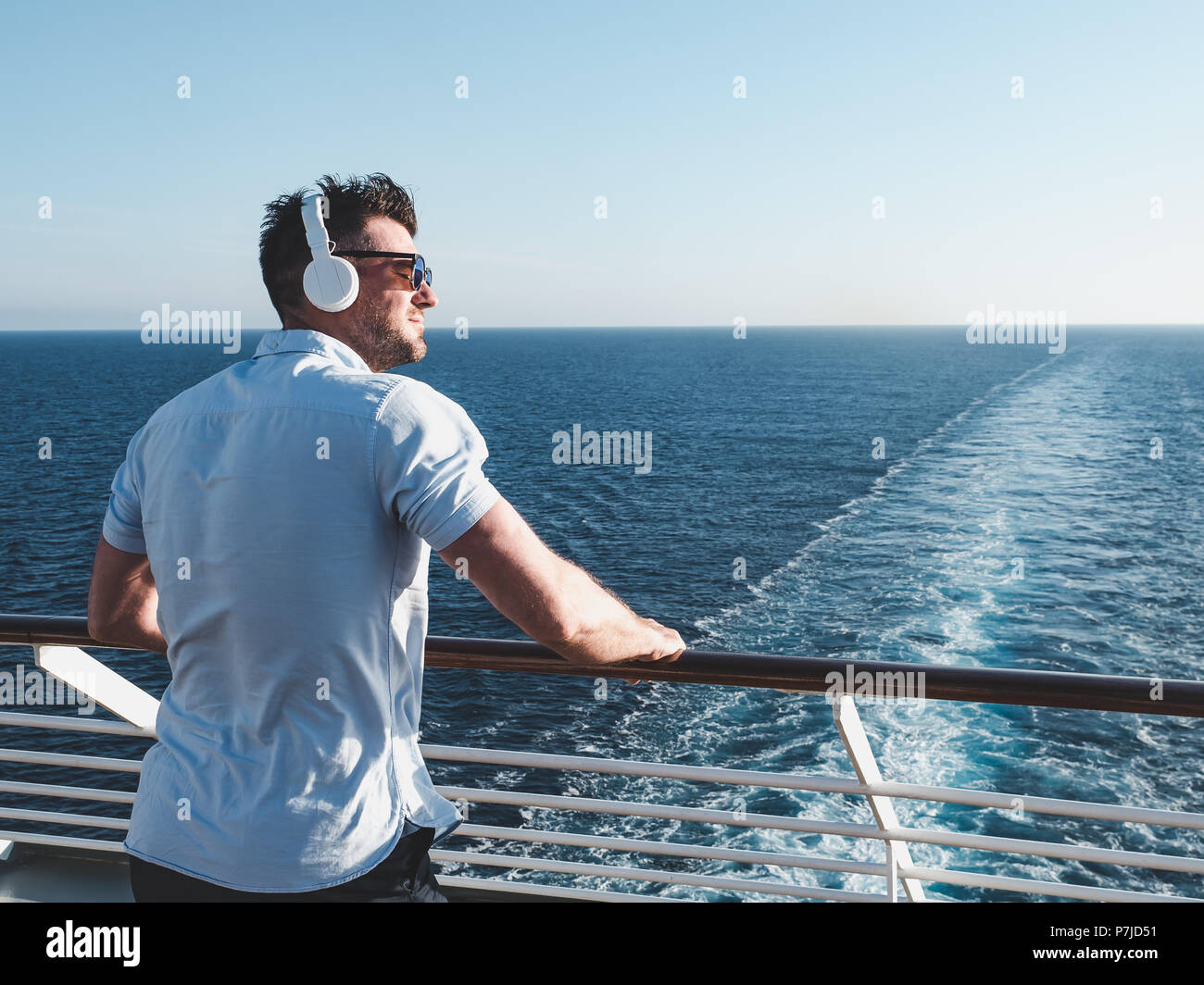 Man on the deck of a cruise ship Stock Photo - Alamy