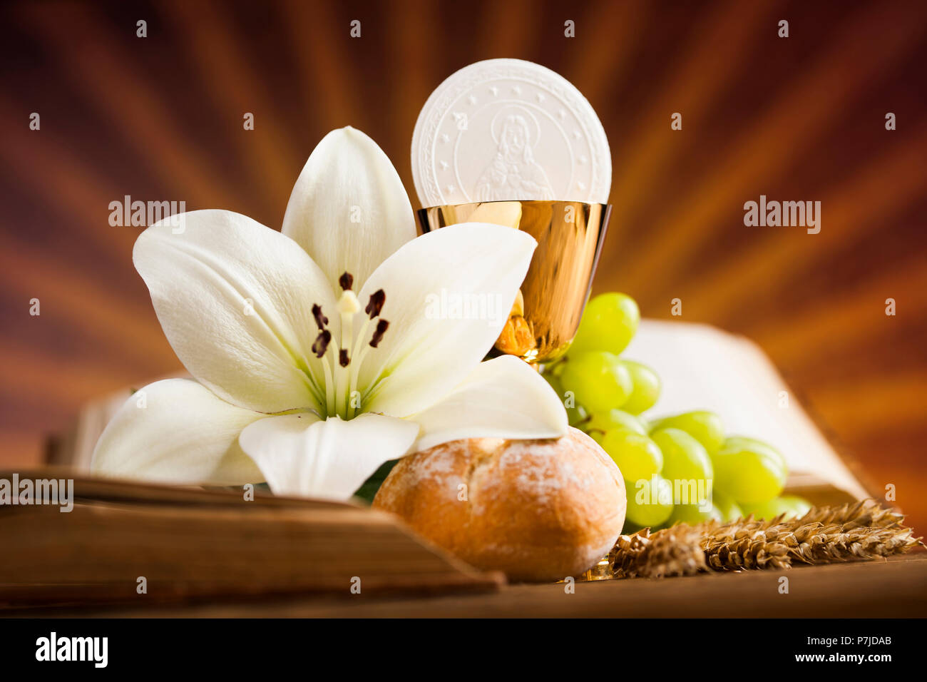 Holy communion a golden chalice with grapes and bread wafers Stock ...