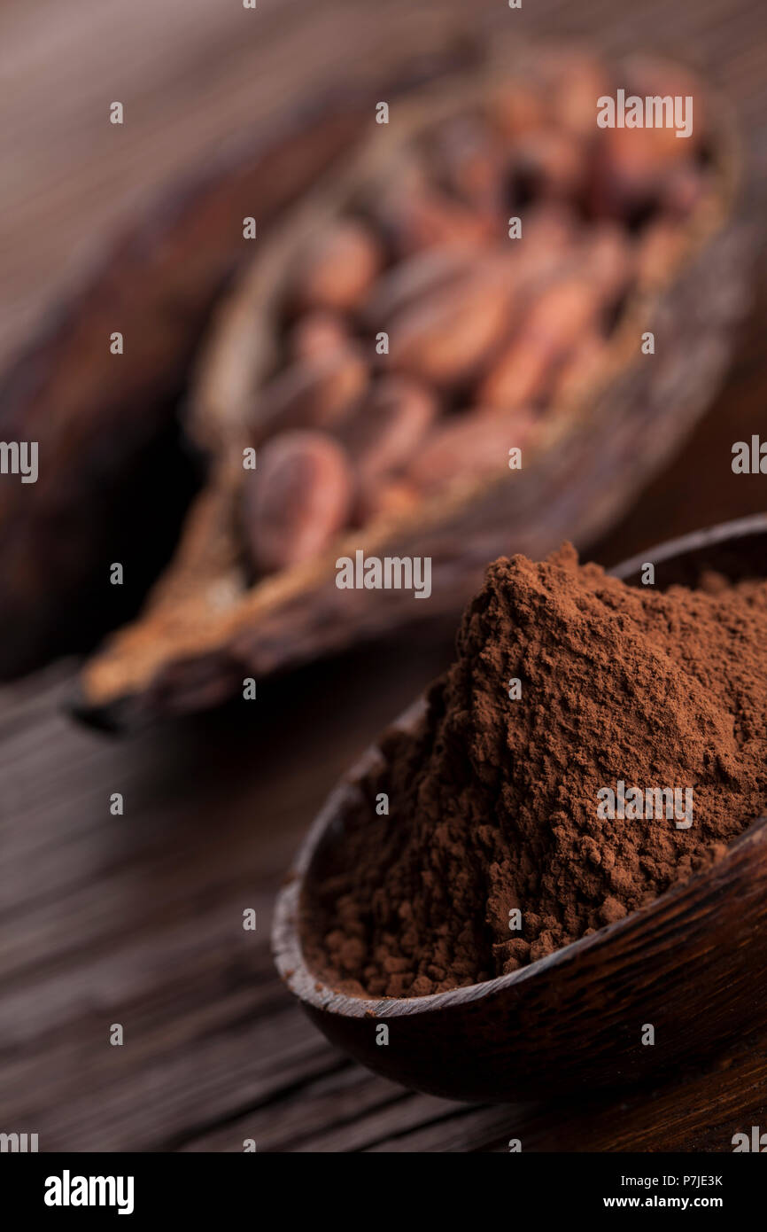 Cacao beans and powder and food dessert background Stock Photo - Alamy