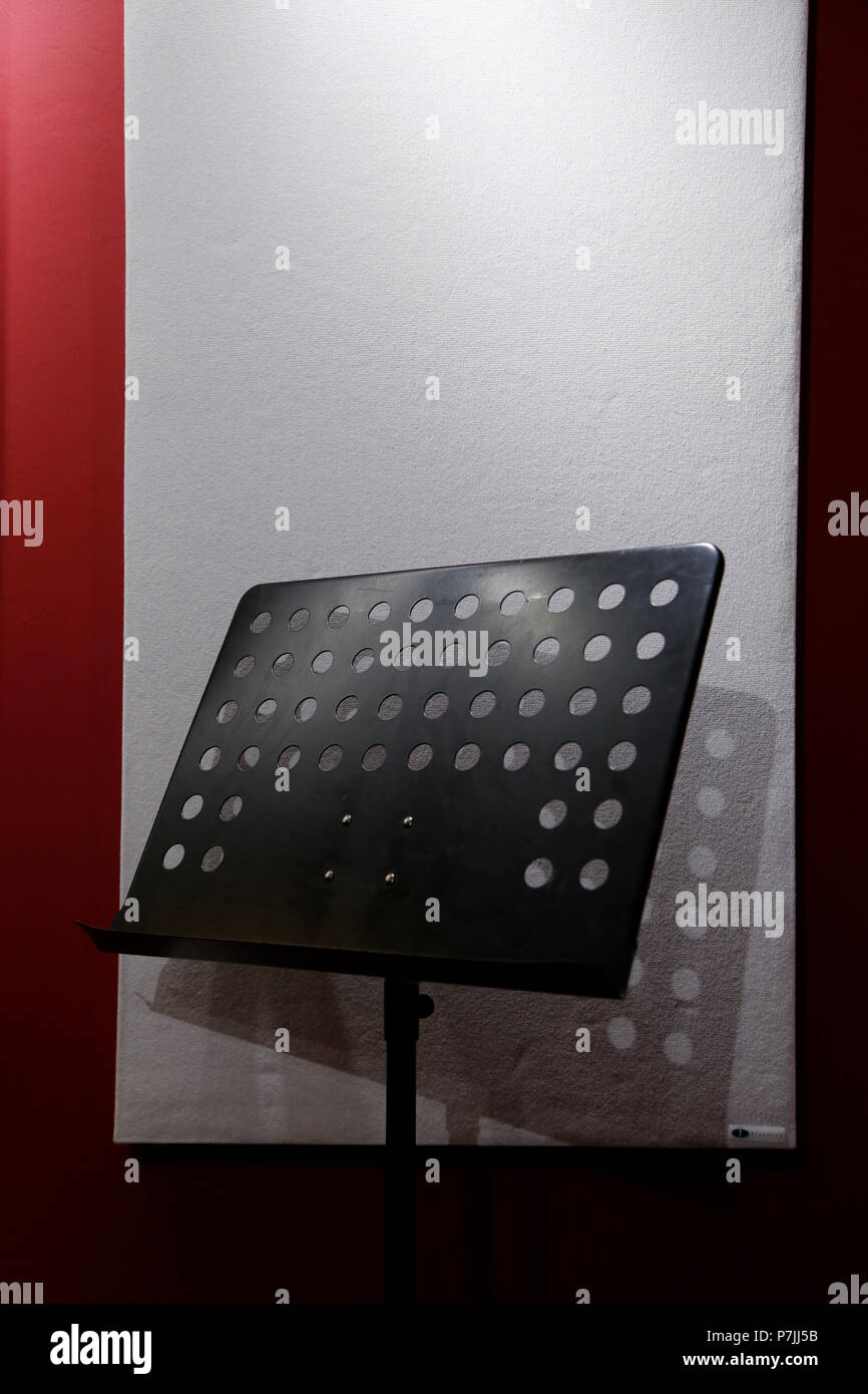 Music stand casting shadow on acoustic board Stock Photo - Alamy