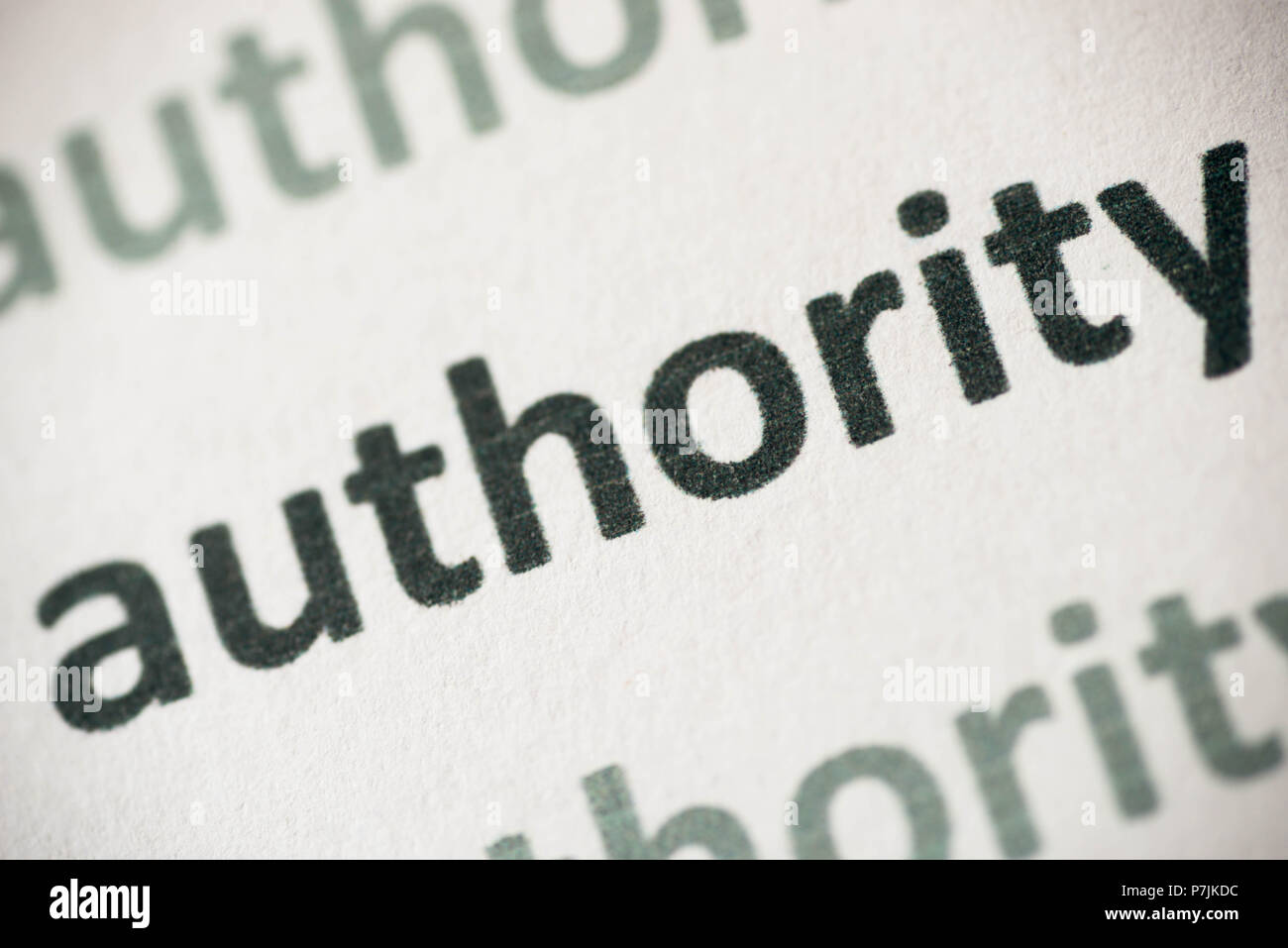 word authority printed on white paper macro Stock Photo - Alamy