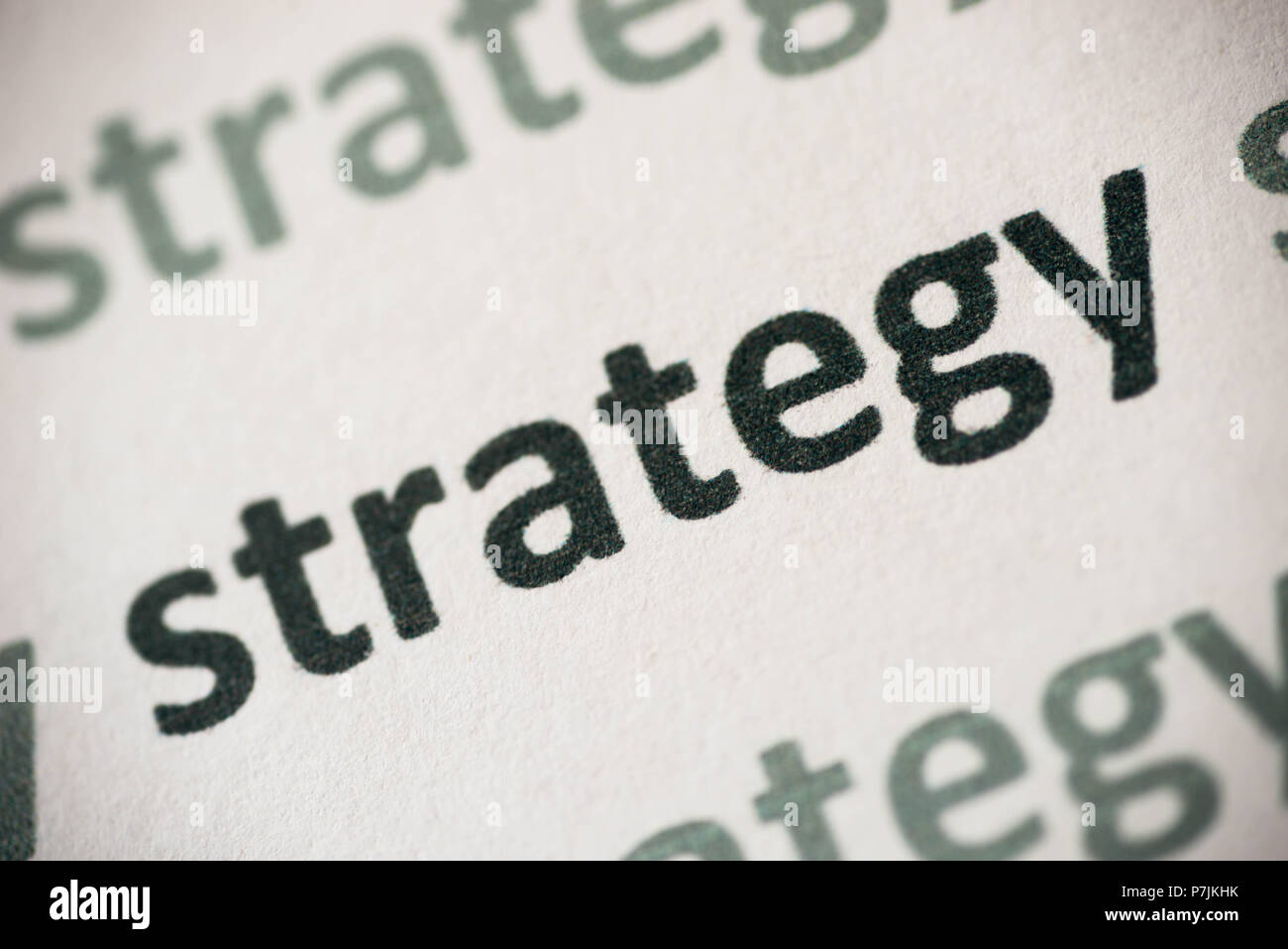 word strategy printed on white paper macro Stock Photo - Alamy