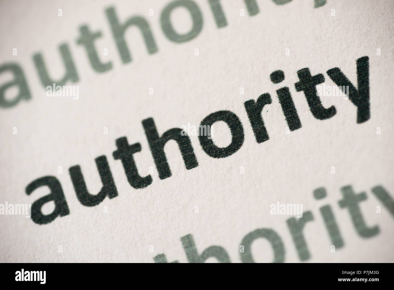 word authority printed on white paper macro Stock Photo - Alamy