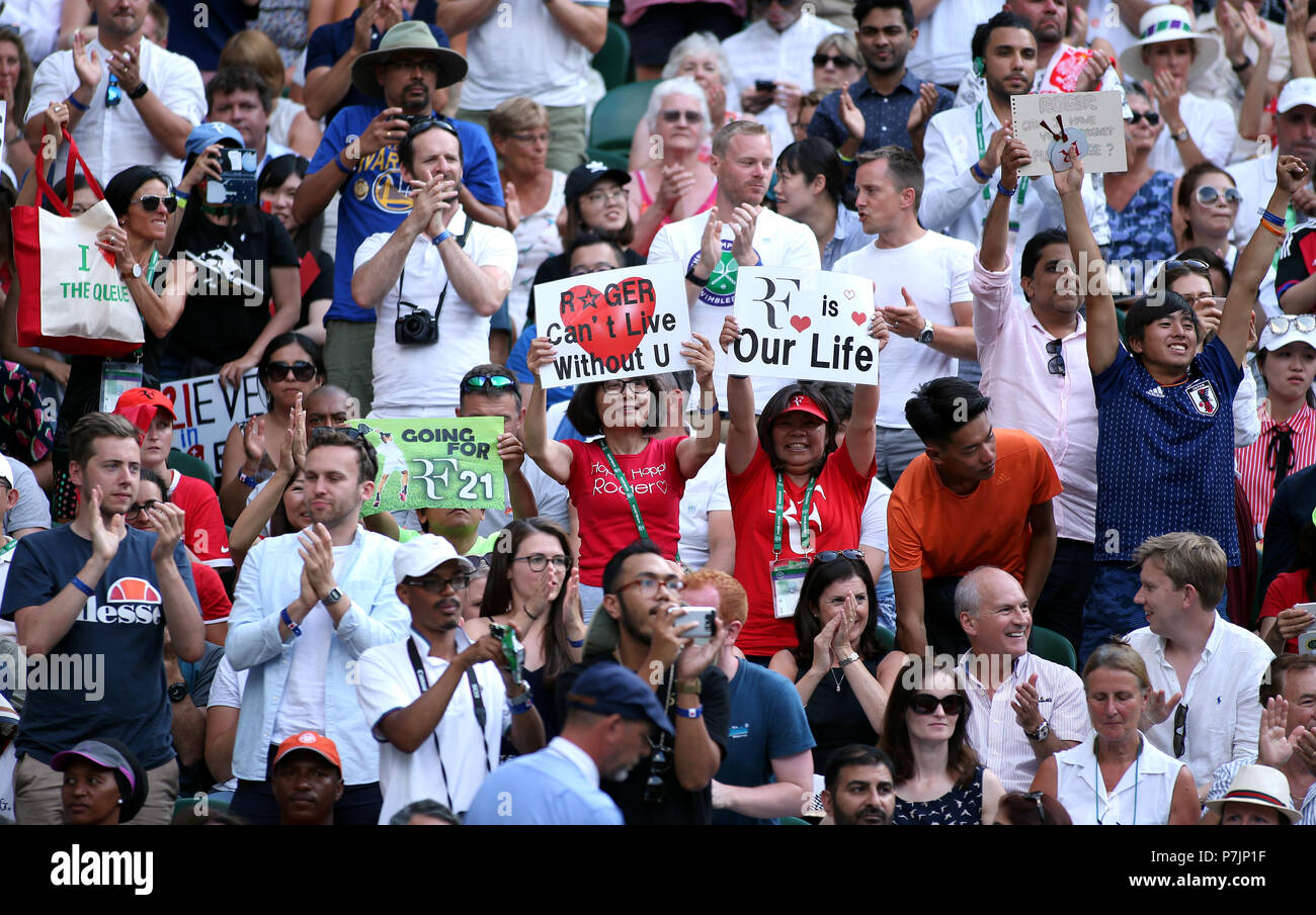 Roger Federer fans in the crowd on centre court on day five of the ...