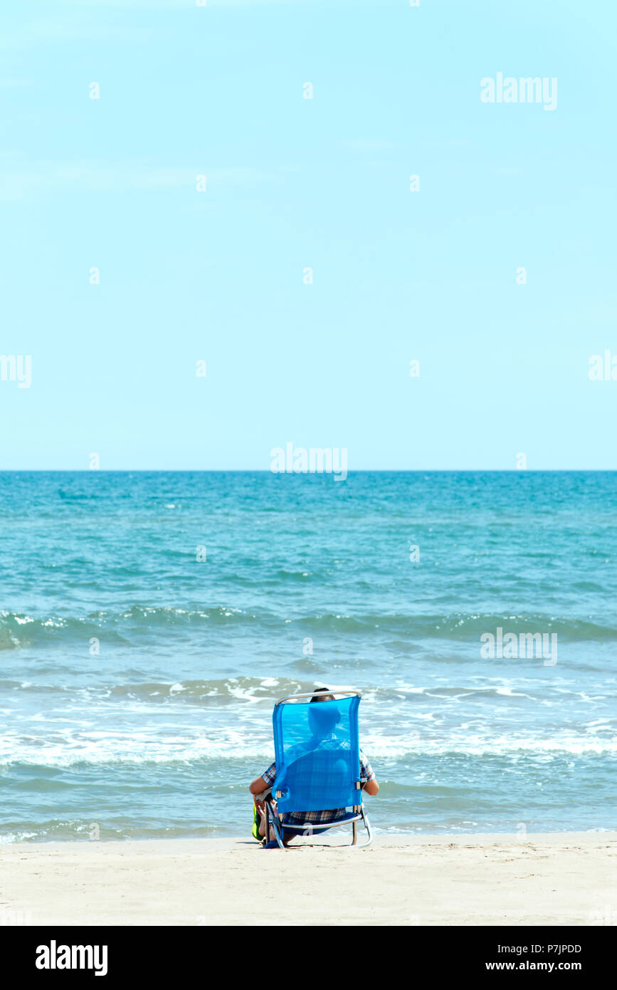 Man on vacation beach chair hi-res stock photography and images - Alamy