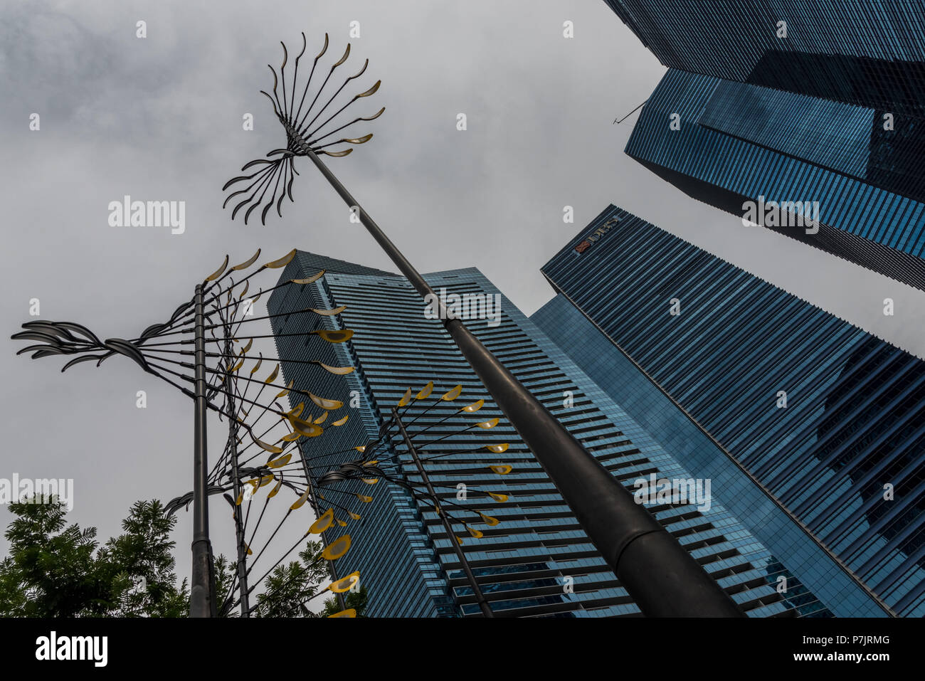 Golden-coloured wind chime, financial district, Singapore, from below ...