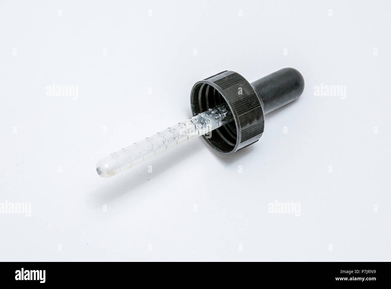 Medicine Dropper in white background Stock Photo - Alamy