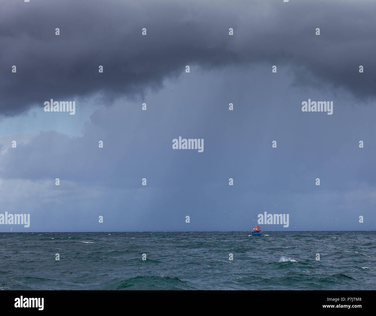 Fishing boat caught in storm hi-res stock photography and images - Alamy