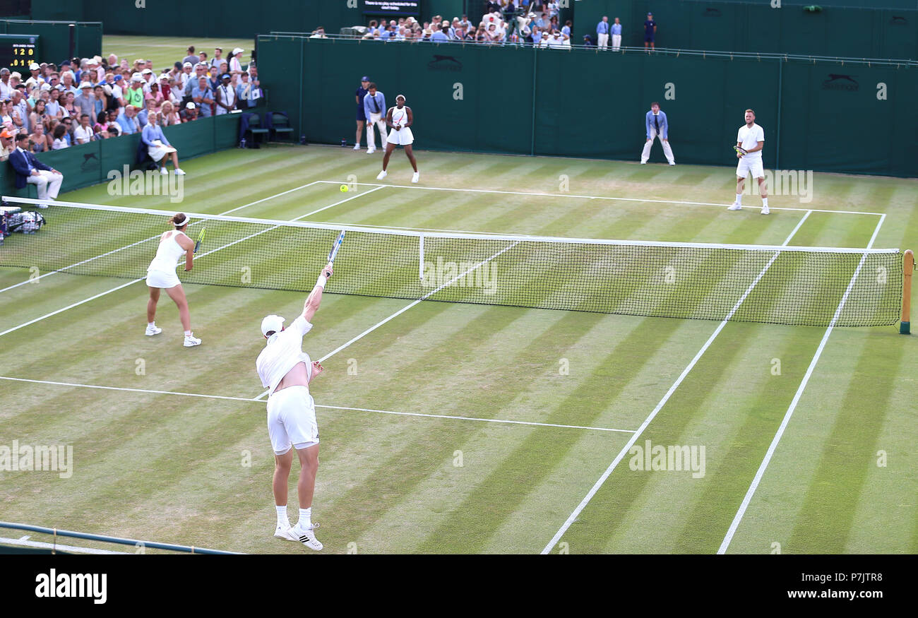 Dominic Inglot serves during the doubles on day five of the Wimbledon ...