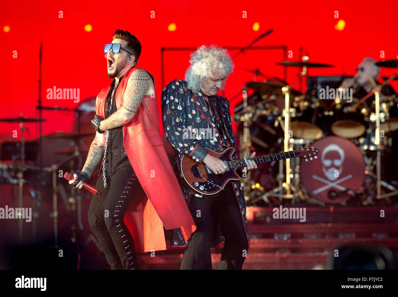 Adam Lambert performs with Brian May from Queen on the main stage ...