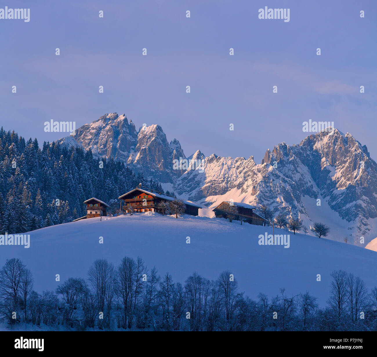 Austria, Tyrol, farm near Kitzbühel against Wilder Kaiser Stock Photo ...