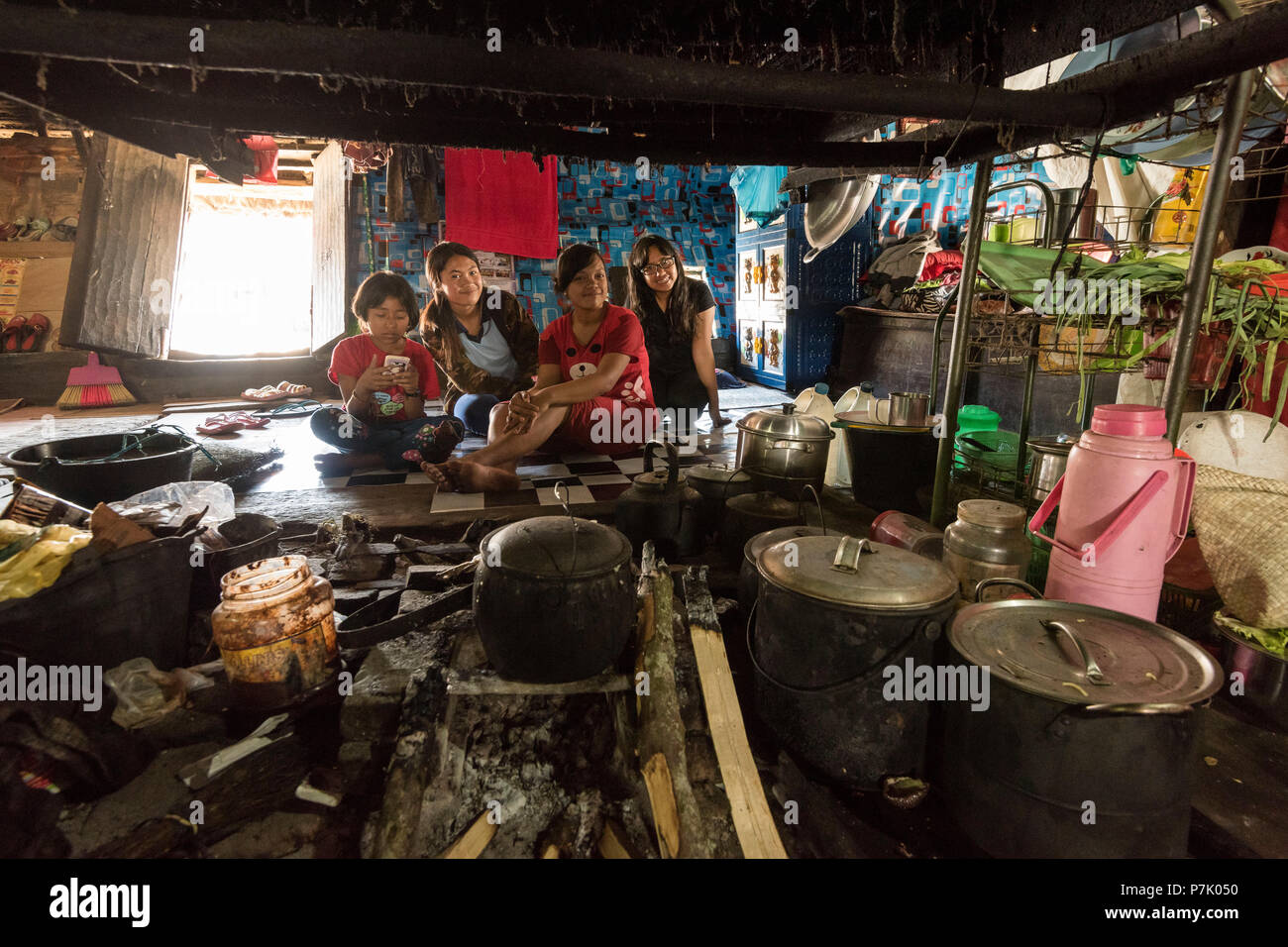 Young Batak girl posing in a traditional Batak house Stock Photo - Alamy