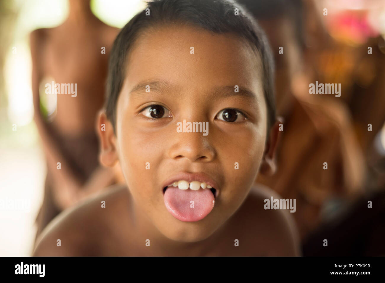 Boy sticking out tongue hi-res stock photography and images - Alamy