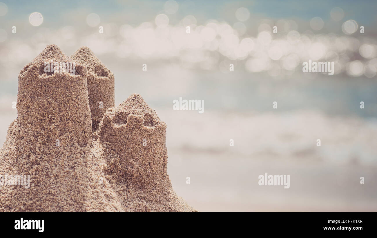 Sand castle standing on the beach. Travel vacations concept Stock Photo ...