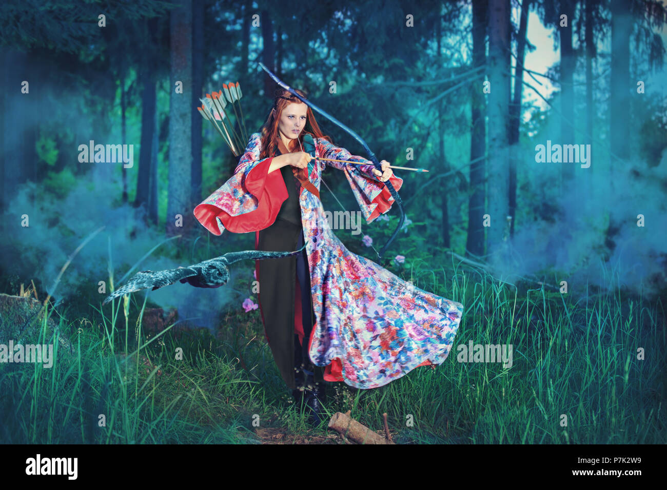 an outdoor portrait of a female elf with bow in a magic forest Stock ...