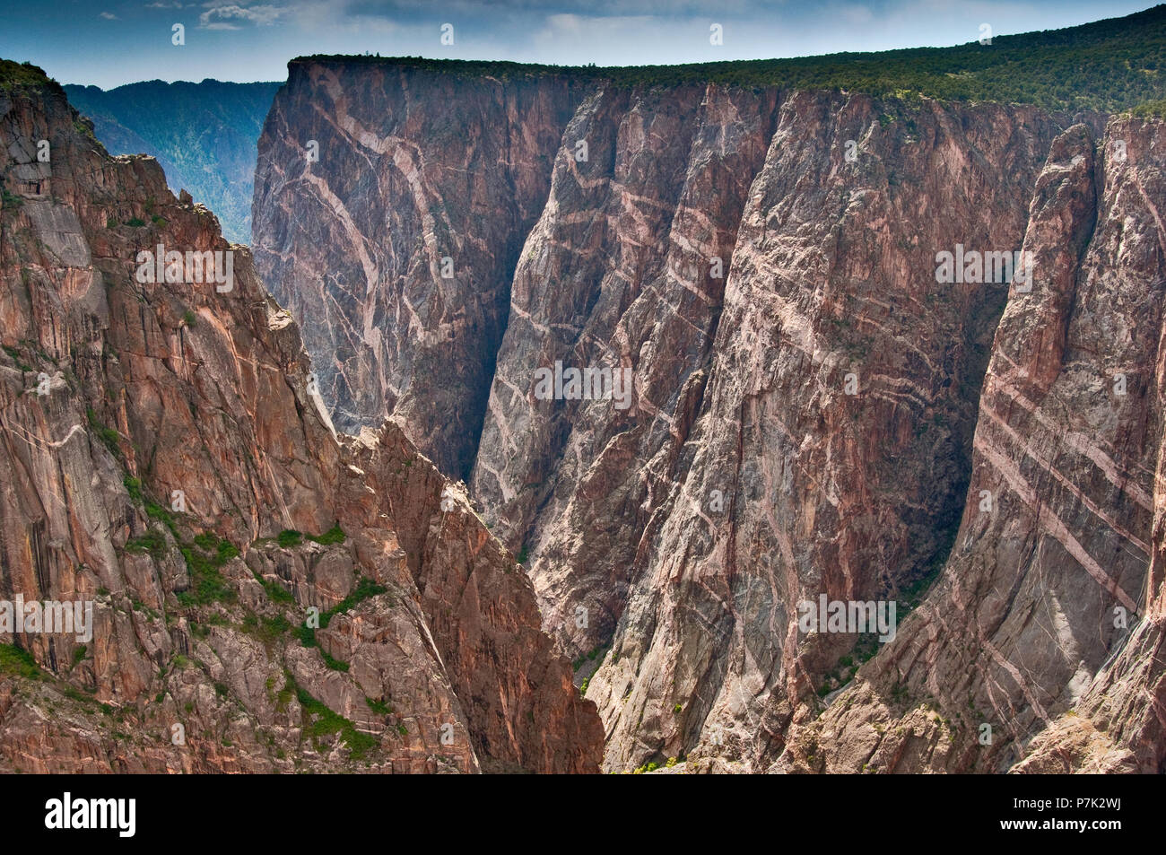 Stripes of pegmatite, light-colored granite, on Painted Wall, from ...