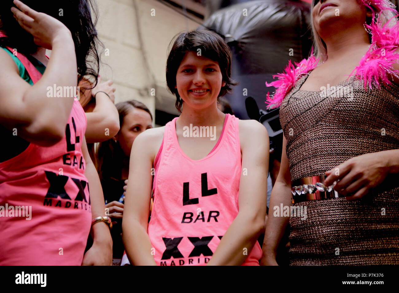 One of the participants poses while she smiles. The high heels race is ...