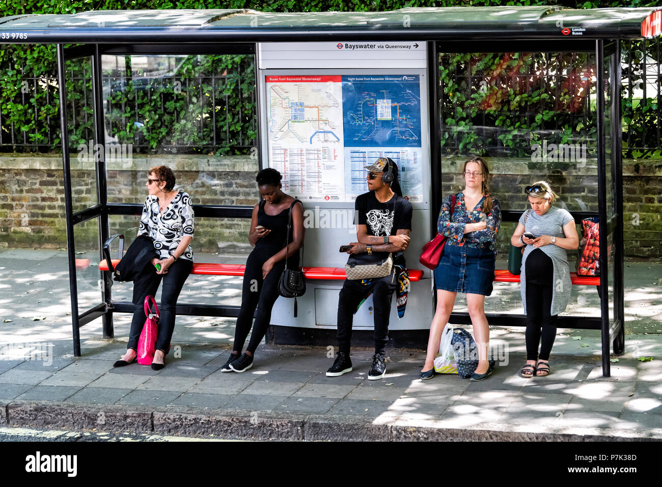 Man waiting bus stop sign hi-res stock photography and images - Alamy