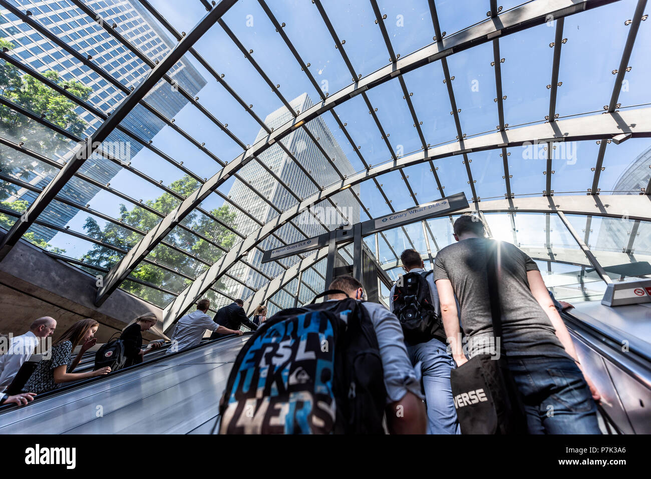 London, UK - June 26, 2018: People crowd commuters riding escalators up ...