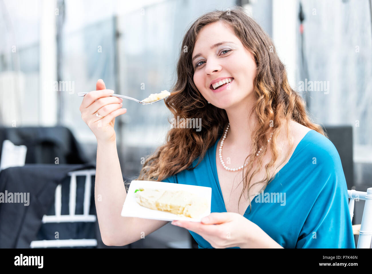 Young elegant fashion smiling happy woman eating cake, open mouth with ...