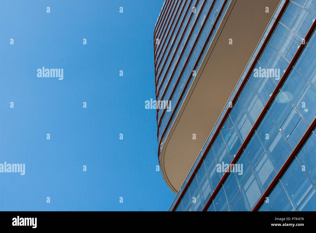 Rounded modern business building detail in a sunny day Stock Photo - Alamy