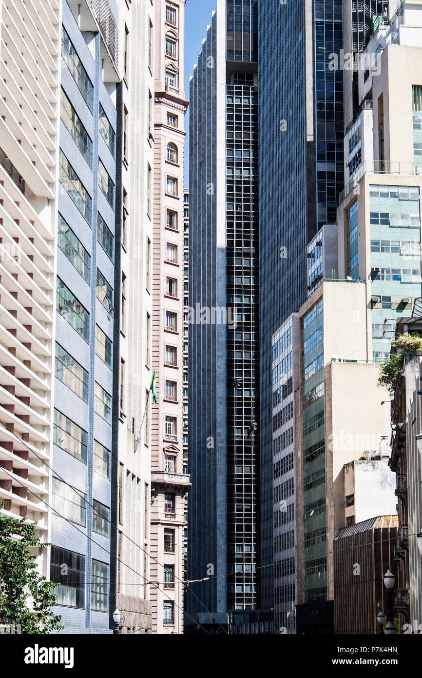 Street full of tall buildings create an illusion of an urban corridor ...