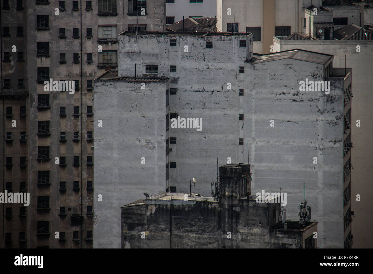Close up view of aged concrete residential and office buildings marked ...