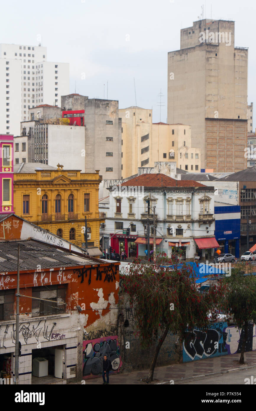 Old and aged randomically painted buildings with orange, pink, yellow ...
