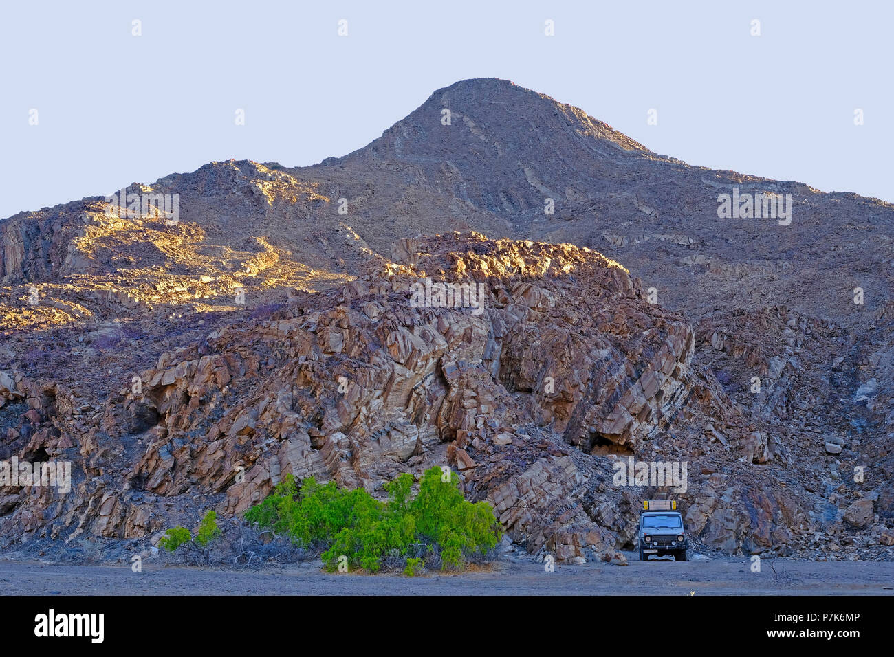 steep, multicoloured sandstone cliffs at a tributary of the dry river ...