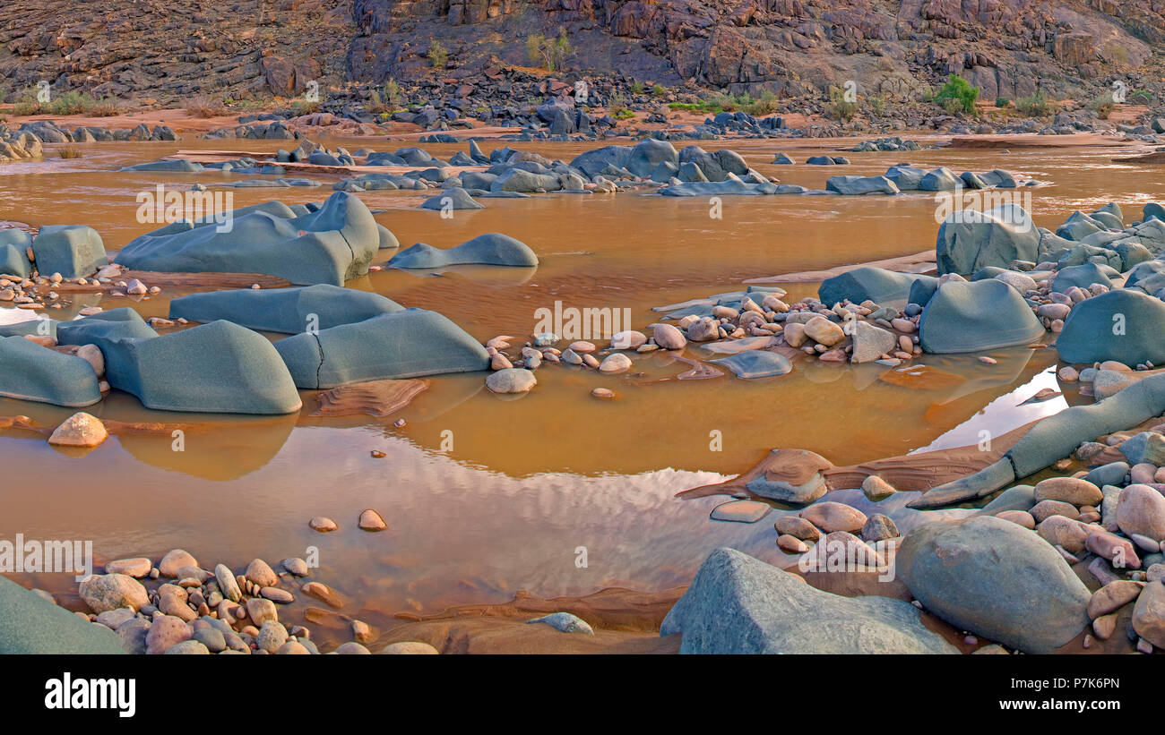 full of cliffs, colourful riverbed of the Fish River in the mouth of ...