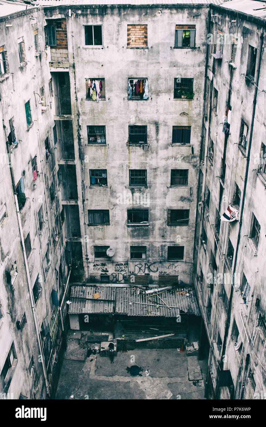 A ruined abandoned c shape building with square windows in San Paolo ...