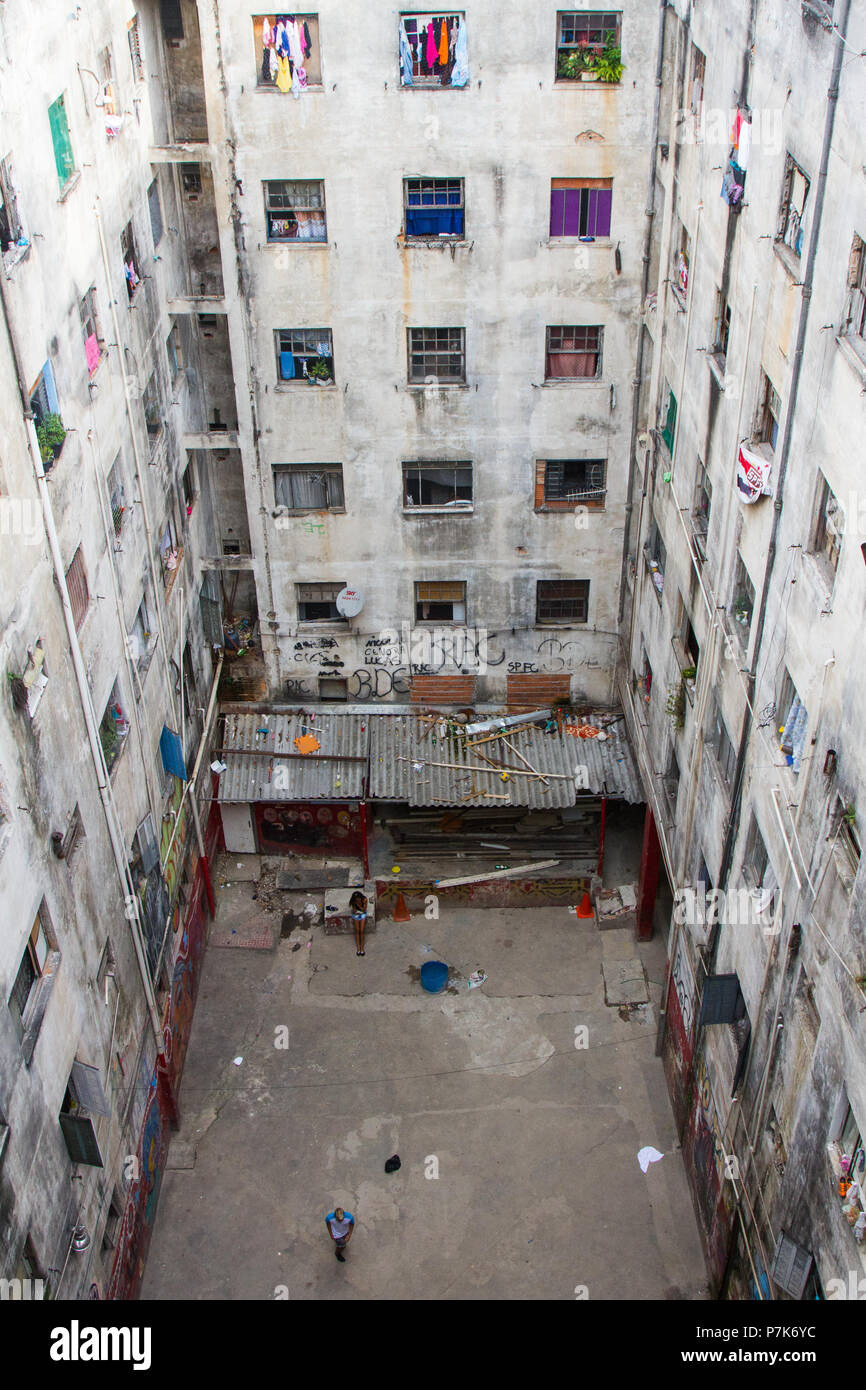A ruined abandoned c shape building with square windows in San Paolo ...