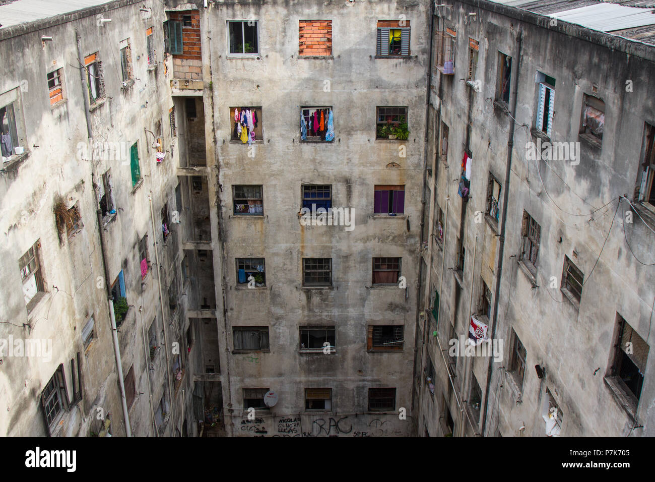 A ruined abandoned c shape building with square windows in San Paolo ...